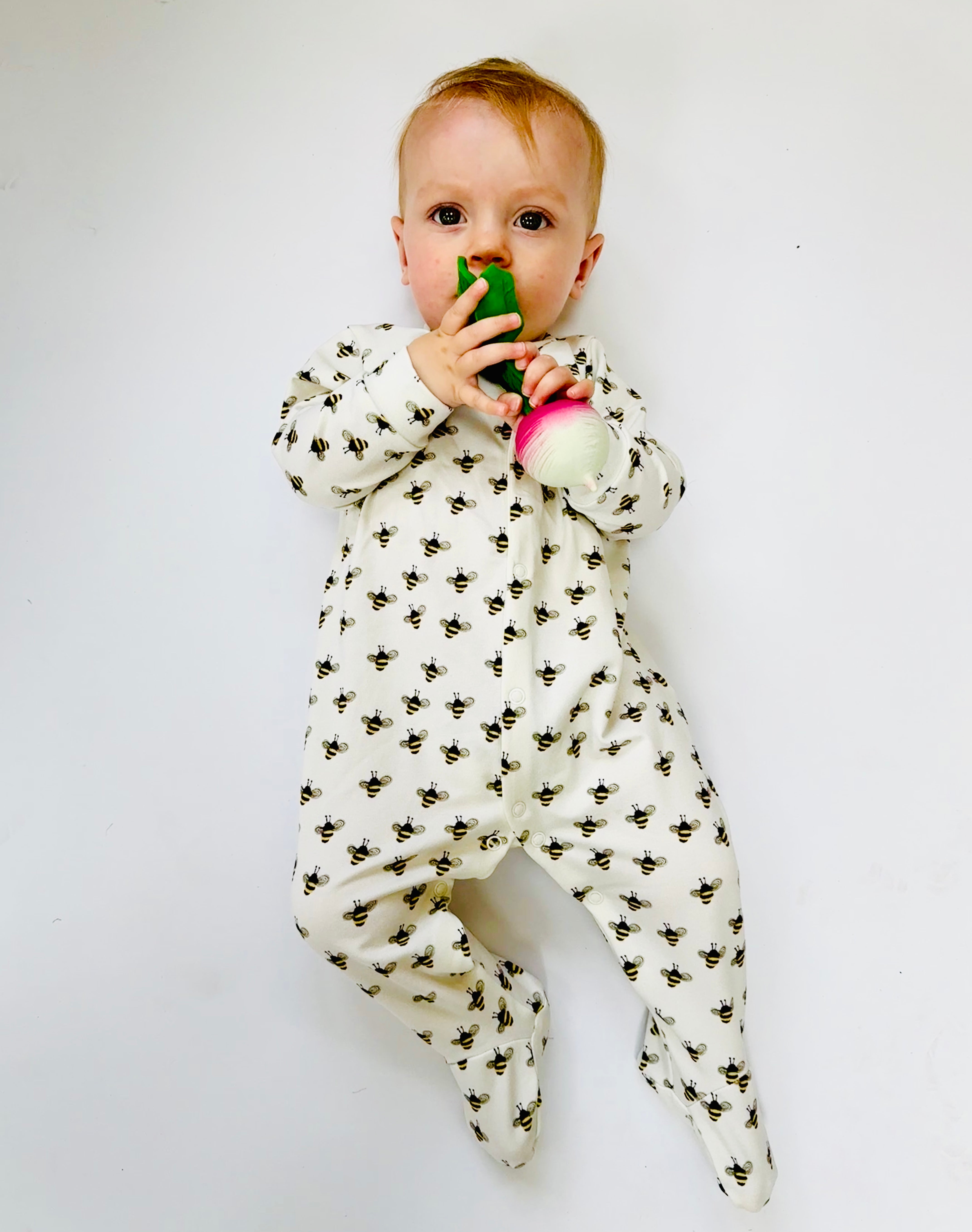 Eddie & Bee organic cotton Baby sleepsuit in Cream " Bees " print.